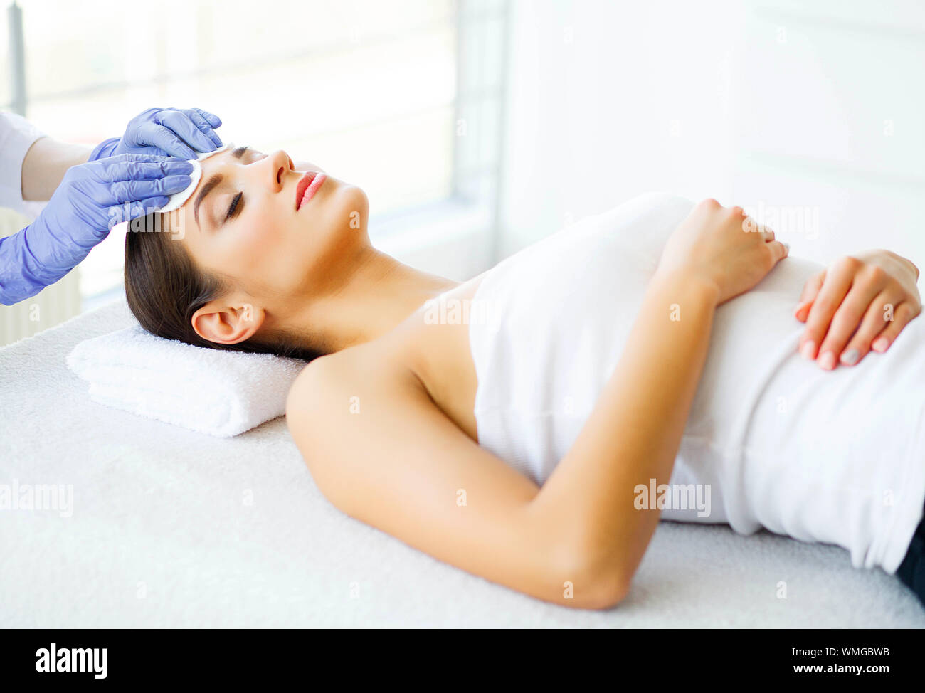 Beauty and Care. Young Girl with Clean Skin in Spa Salon. Woman ...