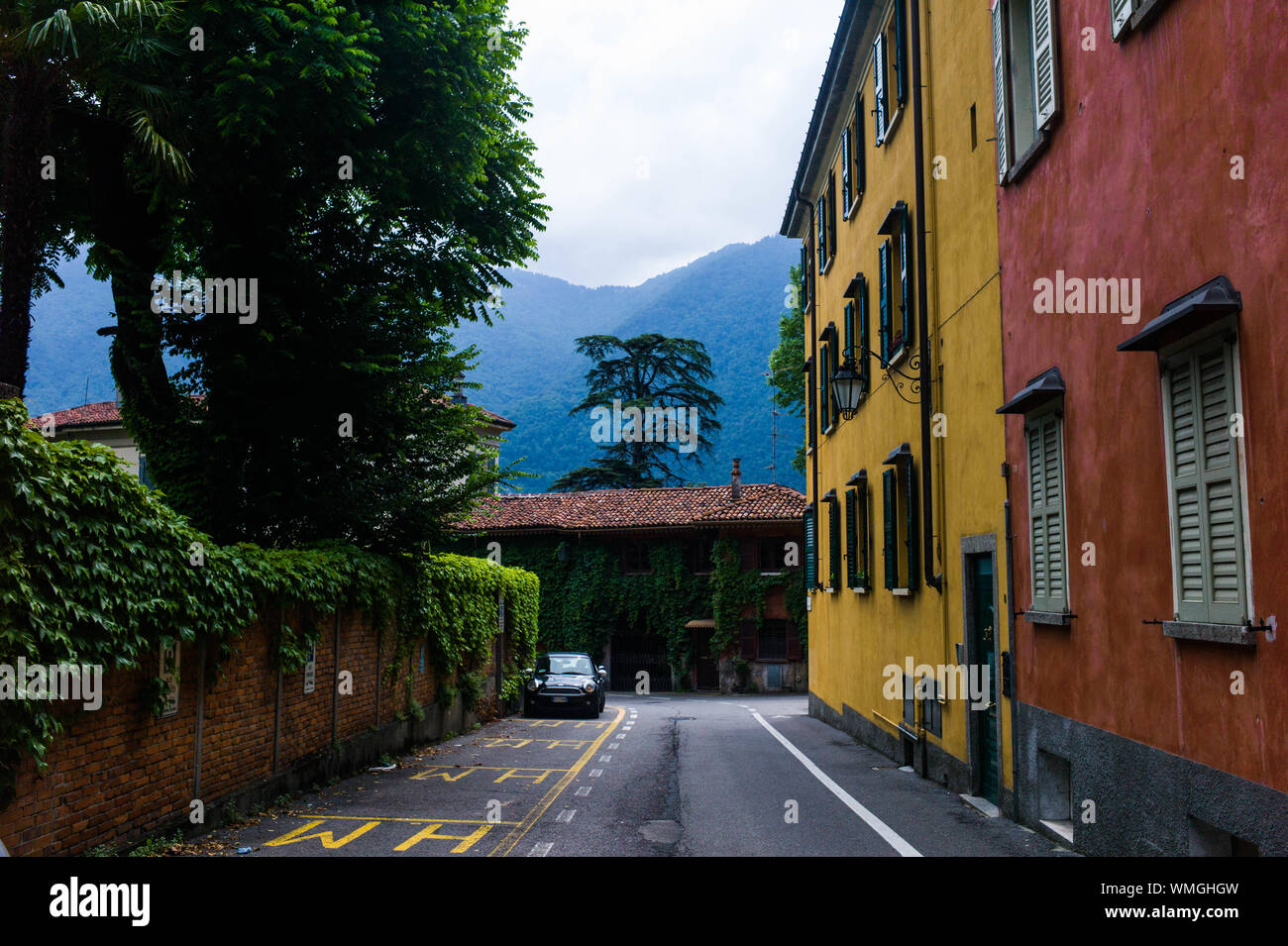 Road By Buildings In Town Stock Photo - Alamy