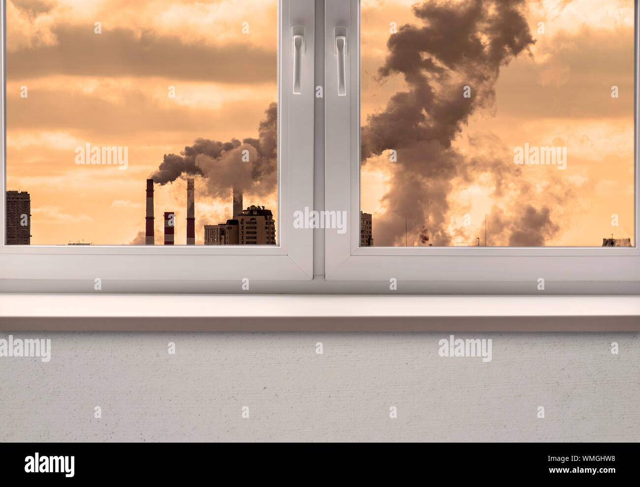 Air pollution over the City and clean white window frame with sill ...