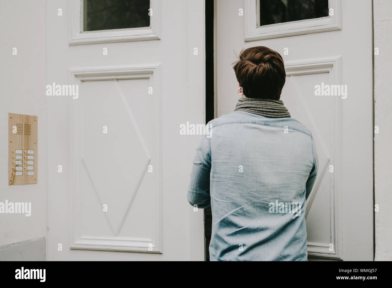 Three man entering house hi-res stock photography and images - Alamy