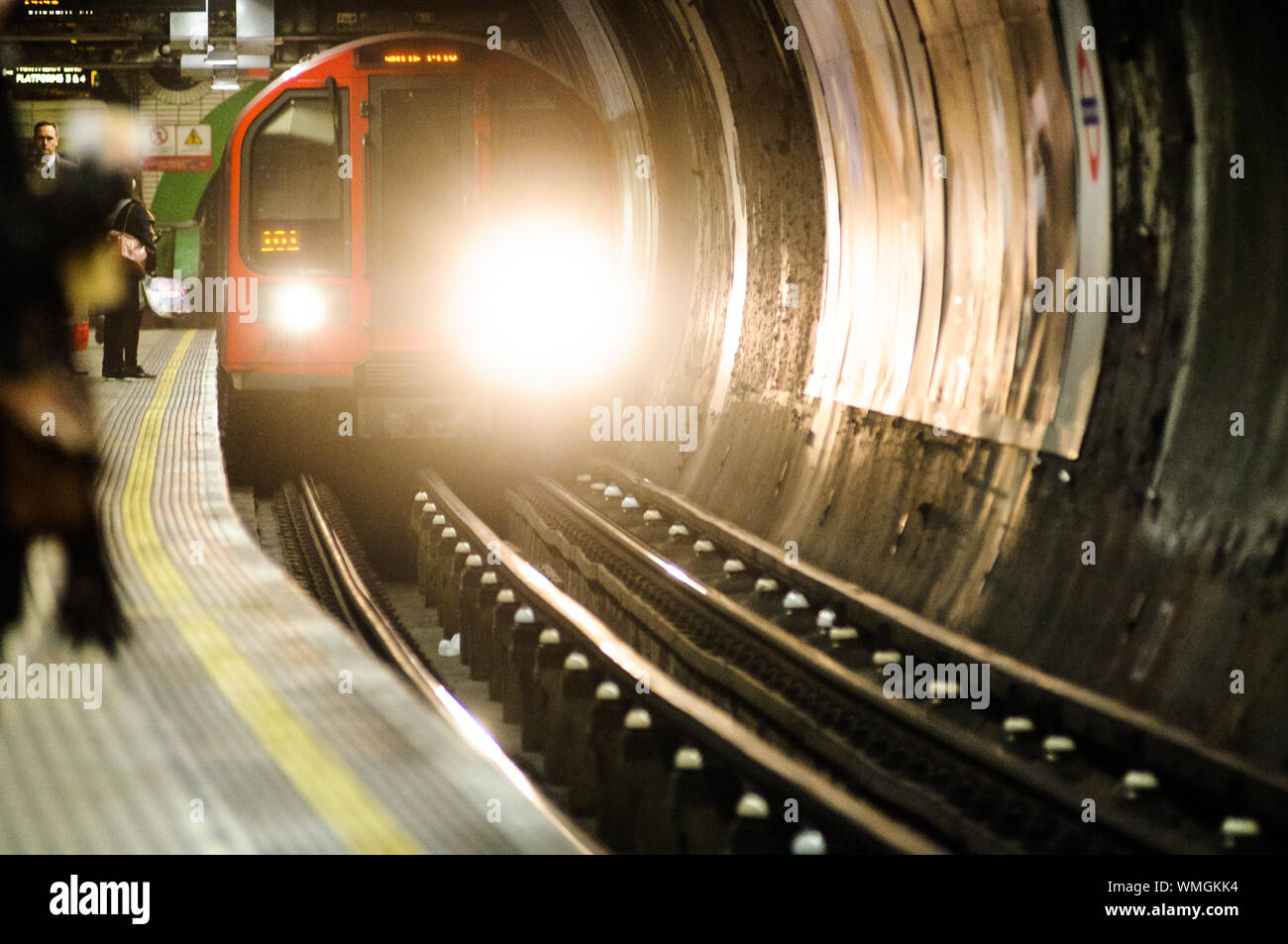 Train Arriving On Railroad Station Platform Stock Photo - Alamy