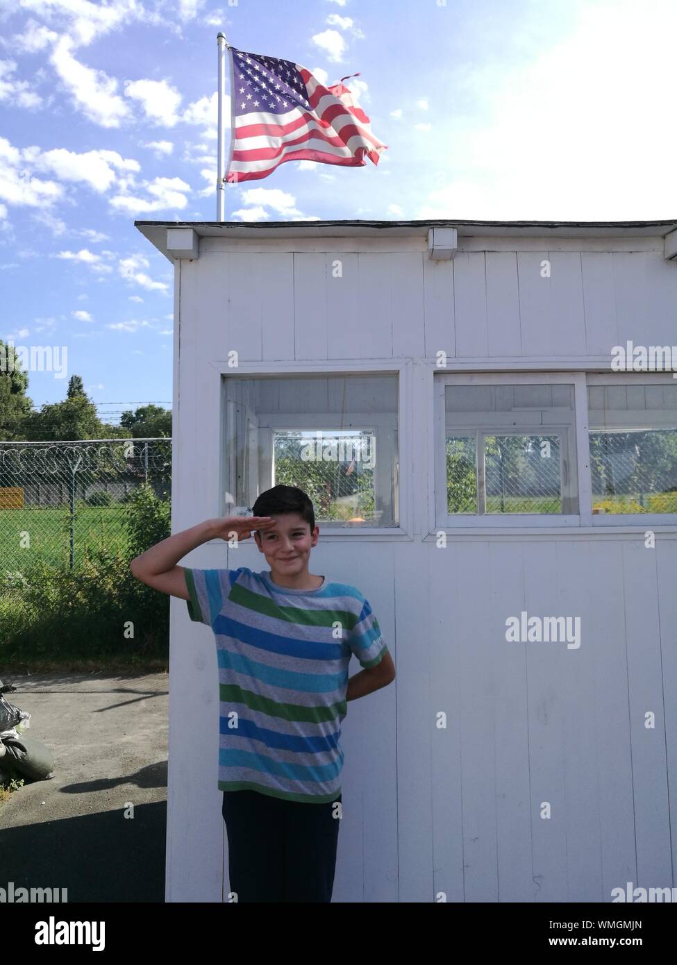 One child saluting flag hi-res stock photography and images - Alamy