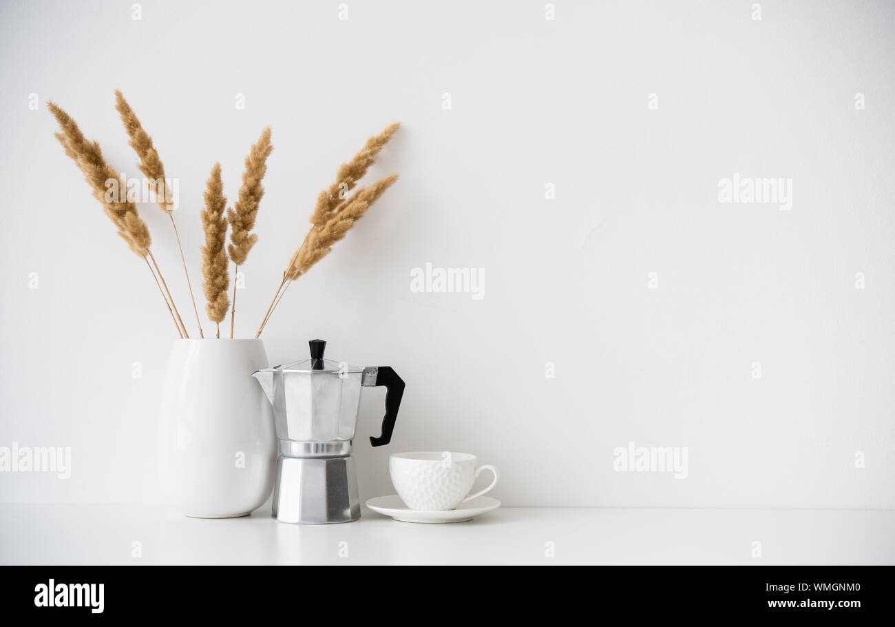White home decor, coffee maker, ceramic vase and cup on tabletop ...