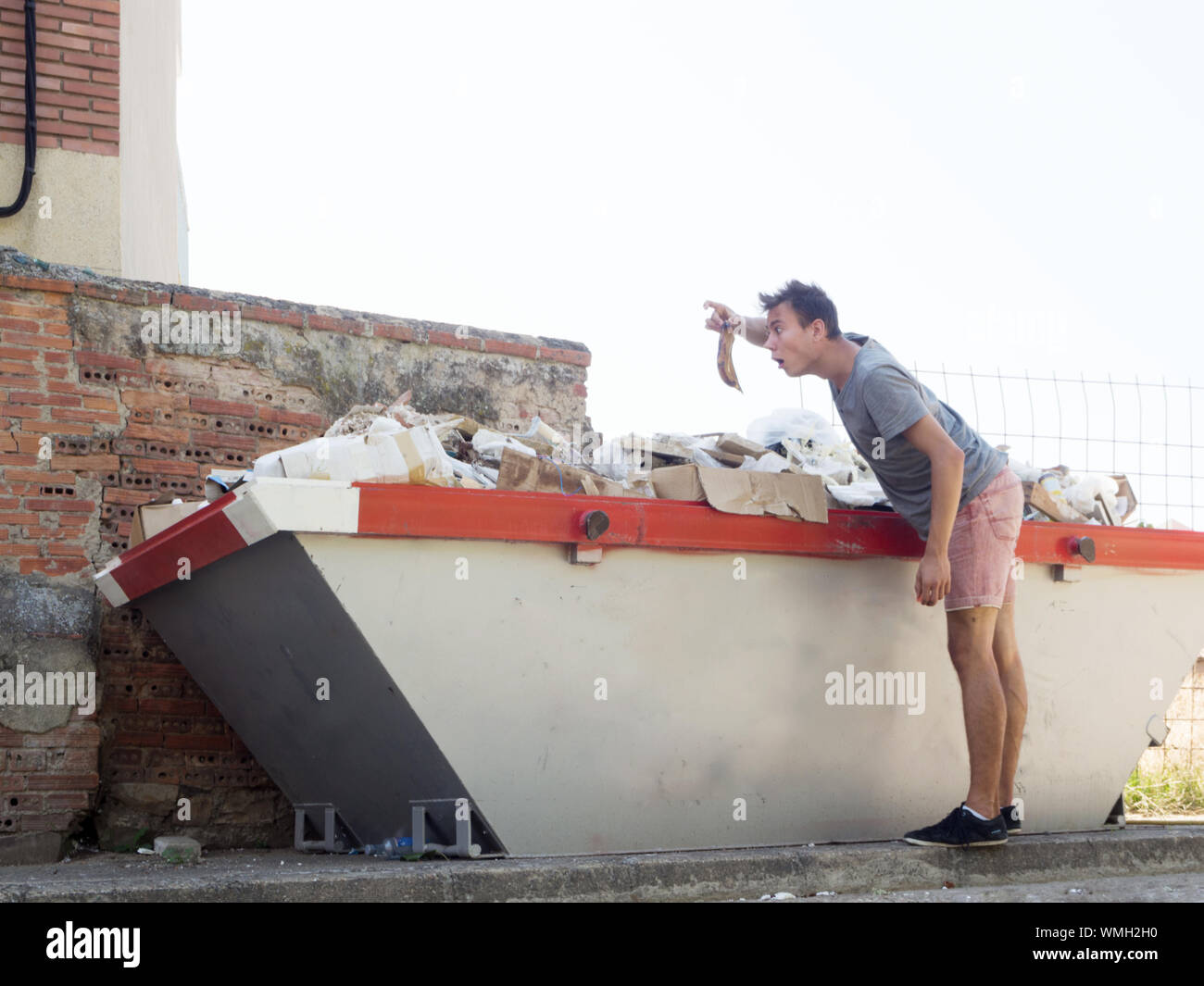 Throwing Garbage In Bin High Resolution Stock Photography and Images ...