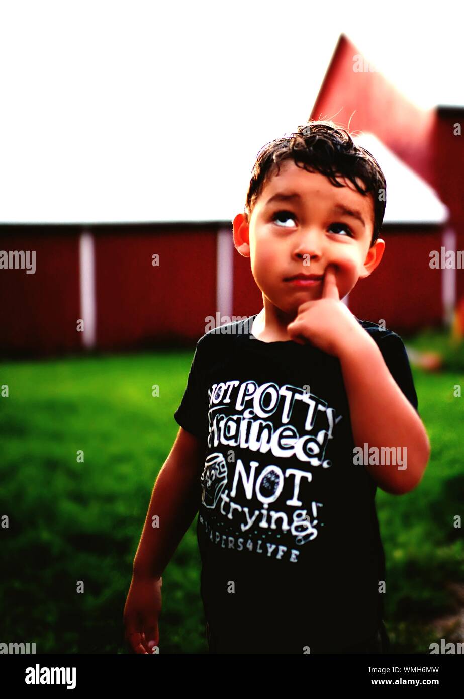 Standing boy thinking hi-res stock photography and images - Alamy