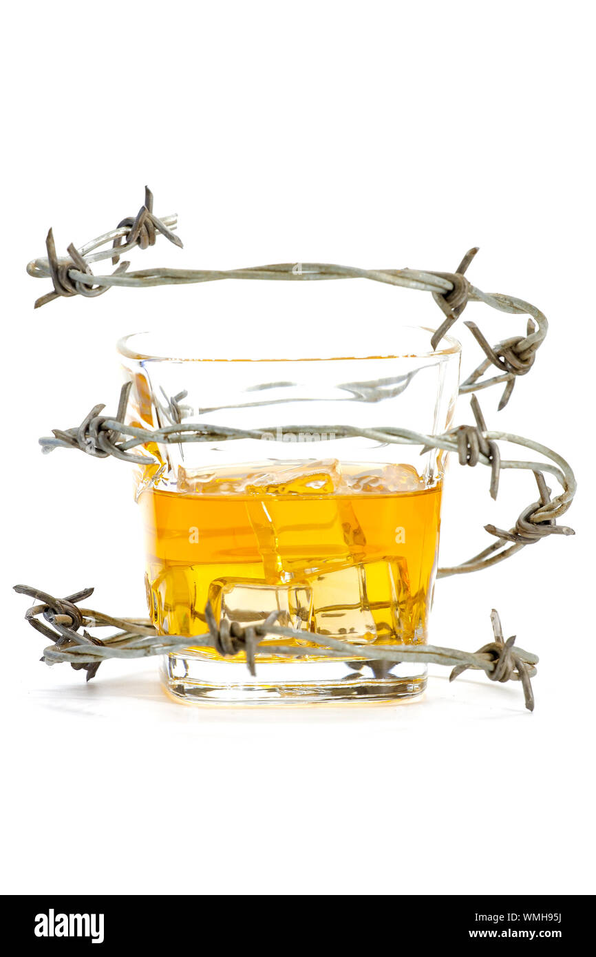 Barbed wire around glass with ice and alcohol on white background Stock ...