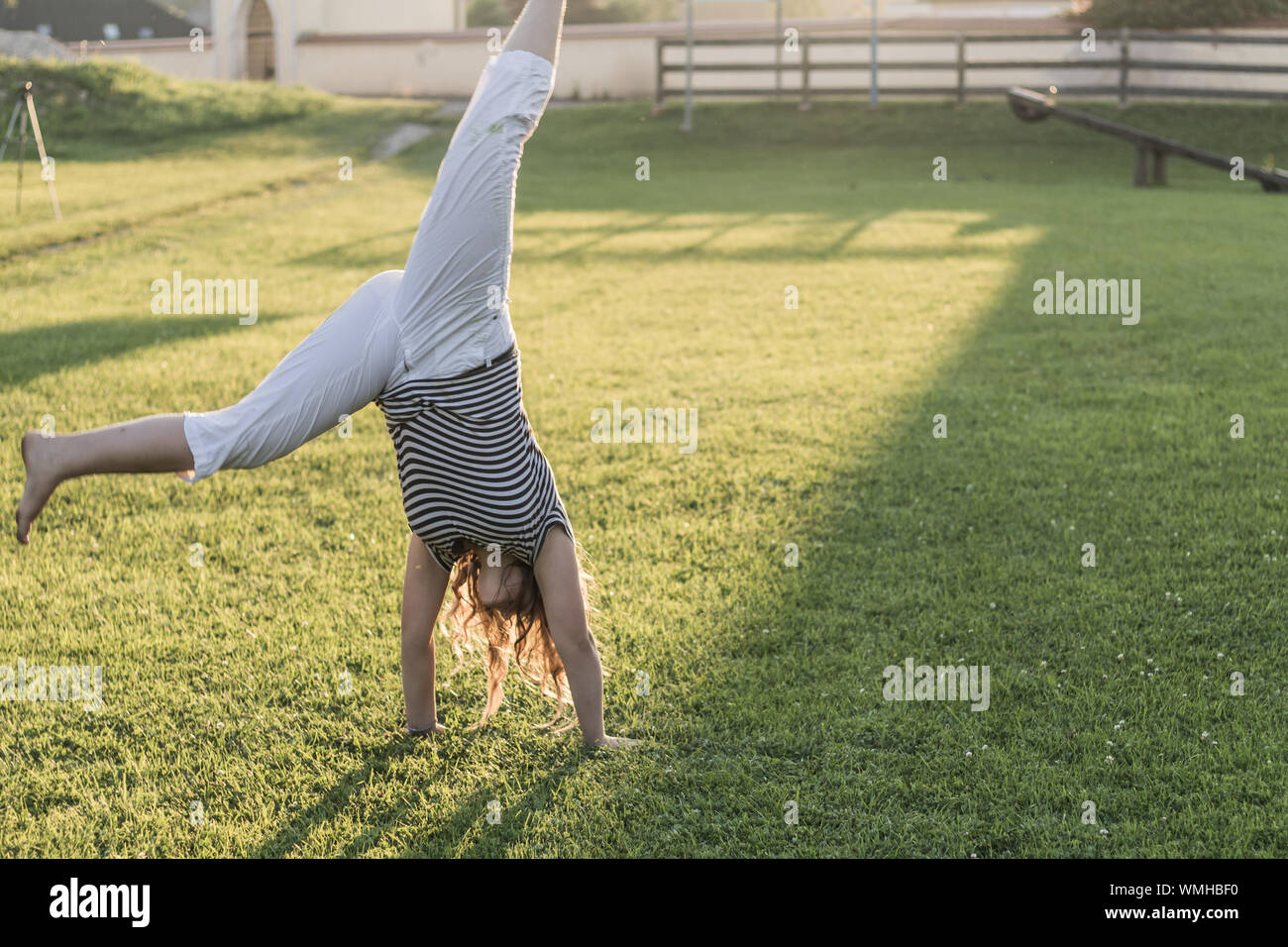 Girl cartwheel handstand hi-res stock photography and images - Alamy