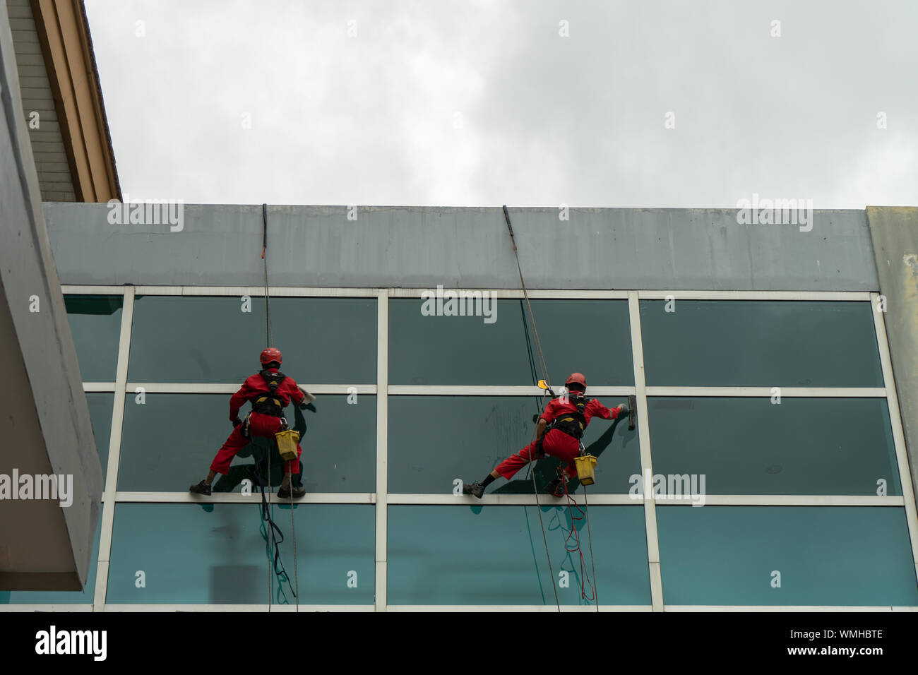 Janitors or cleaning service were cleaning the window located at the ...