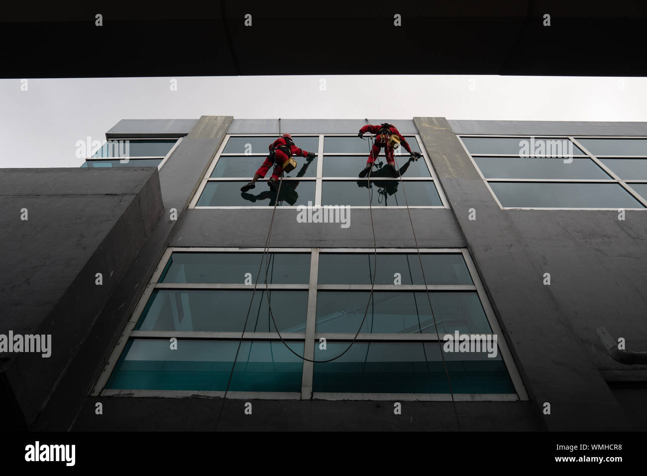 Janitors or cleaning service were cleaning the window located at the ...