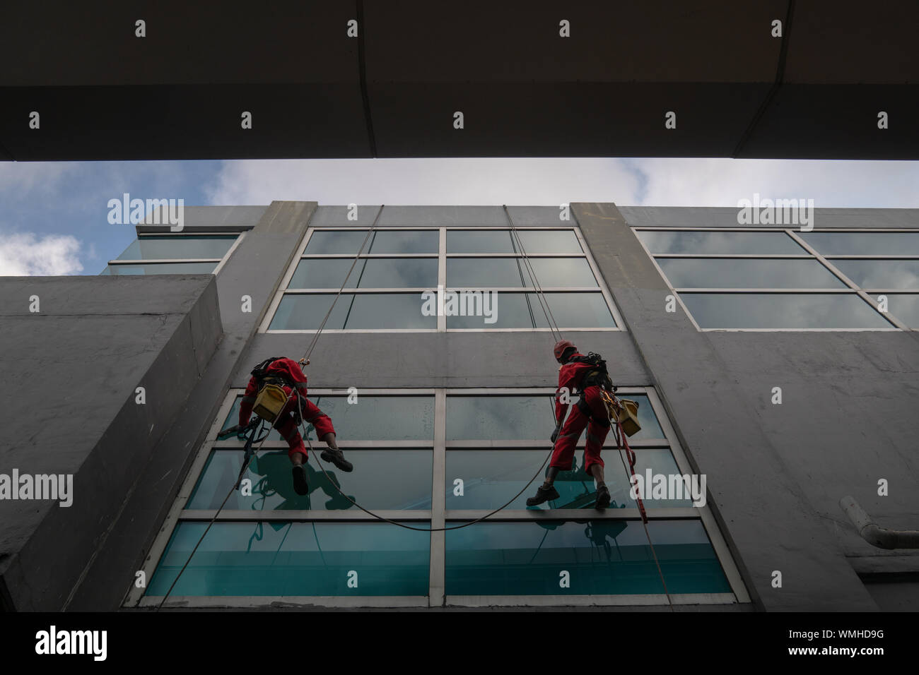 Janitors or cleaning service were cleaning the window located at the ...