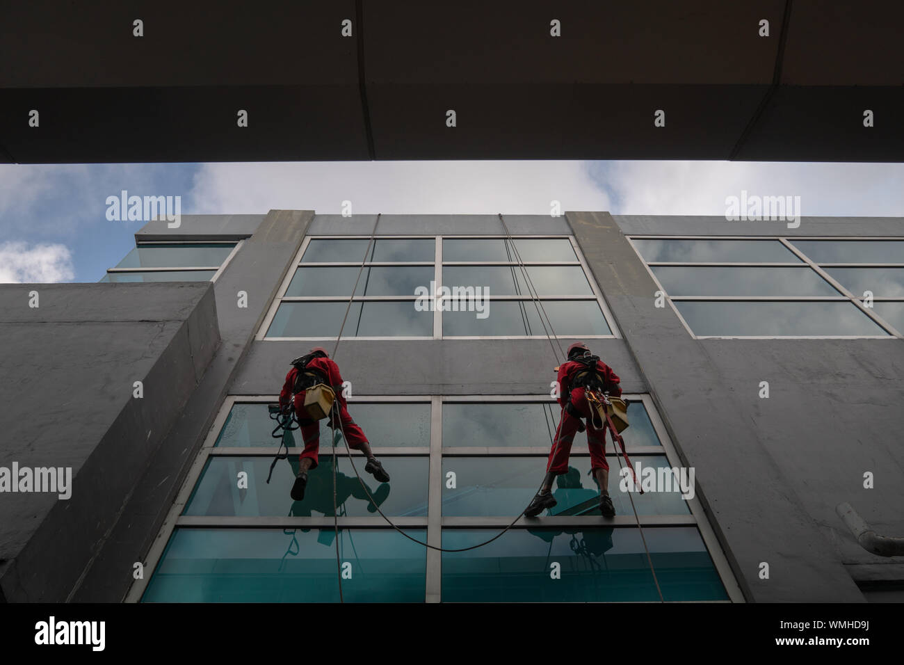 Janitors or cleaning service were cleaning the window located at the ...