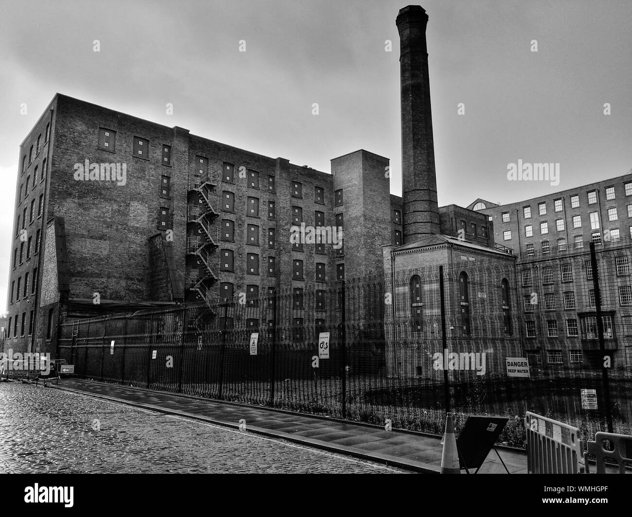 Factory Building With Smoke Stack Stock Photo - Alamy