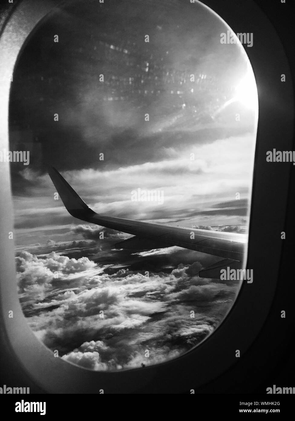 Aircraft wing seen through window Black and White Stock Photos & Images ...