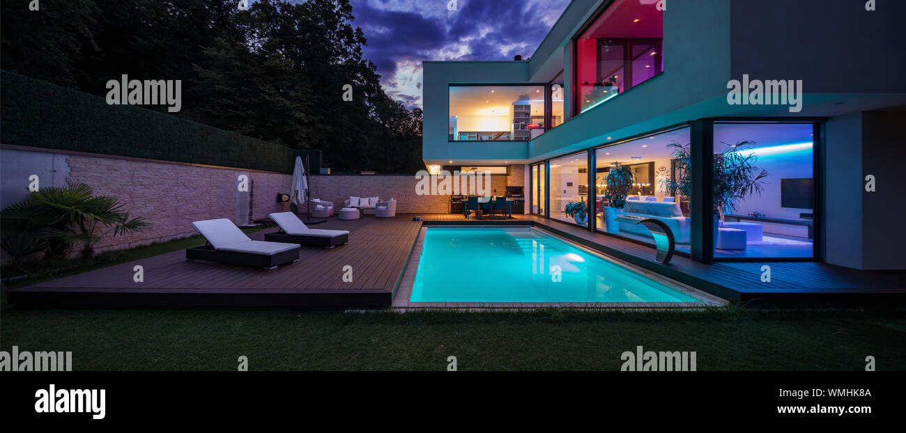 Modern villa with colored led lights at night. Nobody inside Stock ...