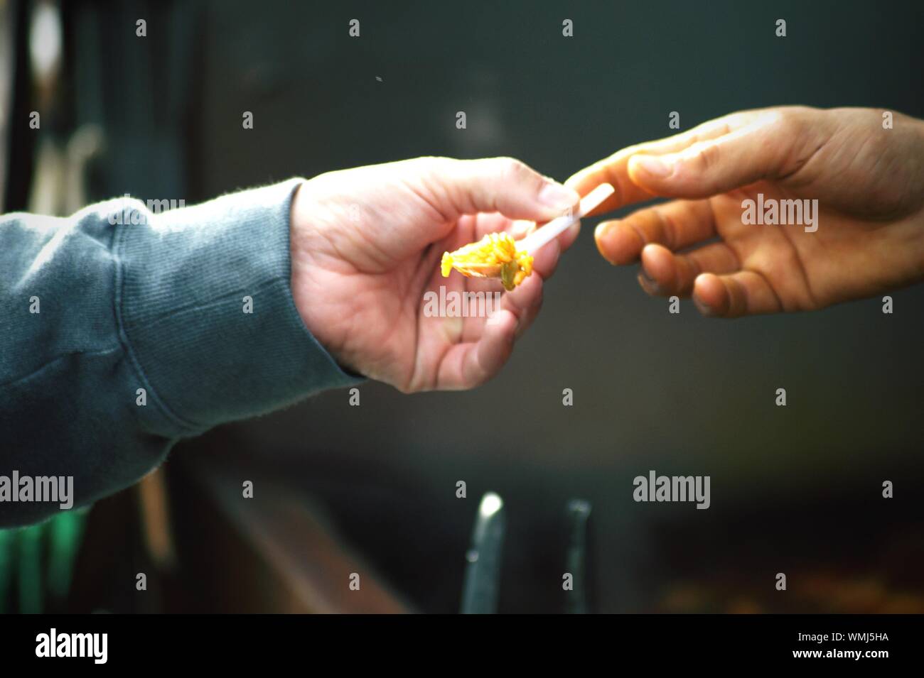 Man giving food hi-res stock photography and images - Alamy