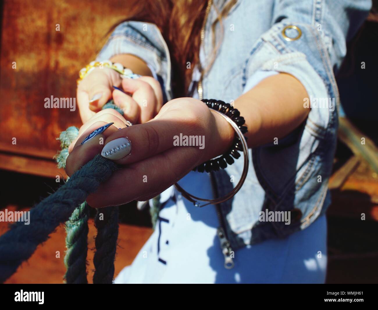 Woman pulling rope hi-res stock photography and images - Alamy