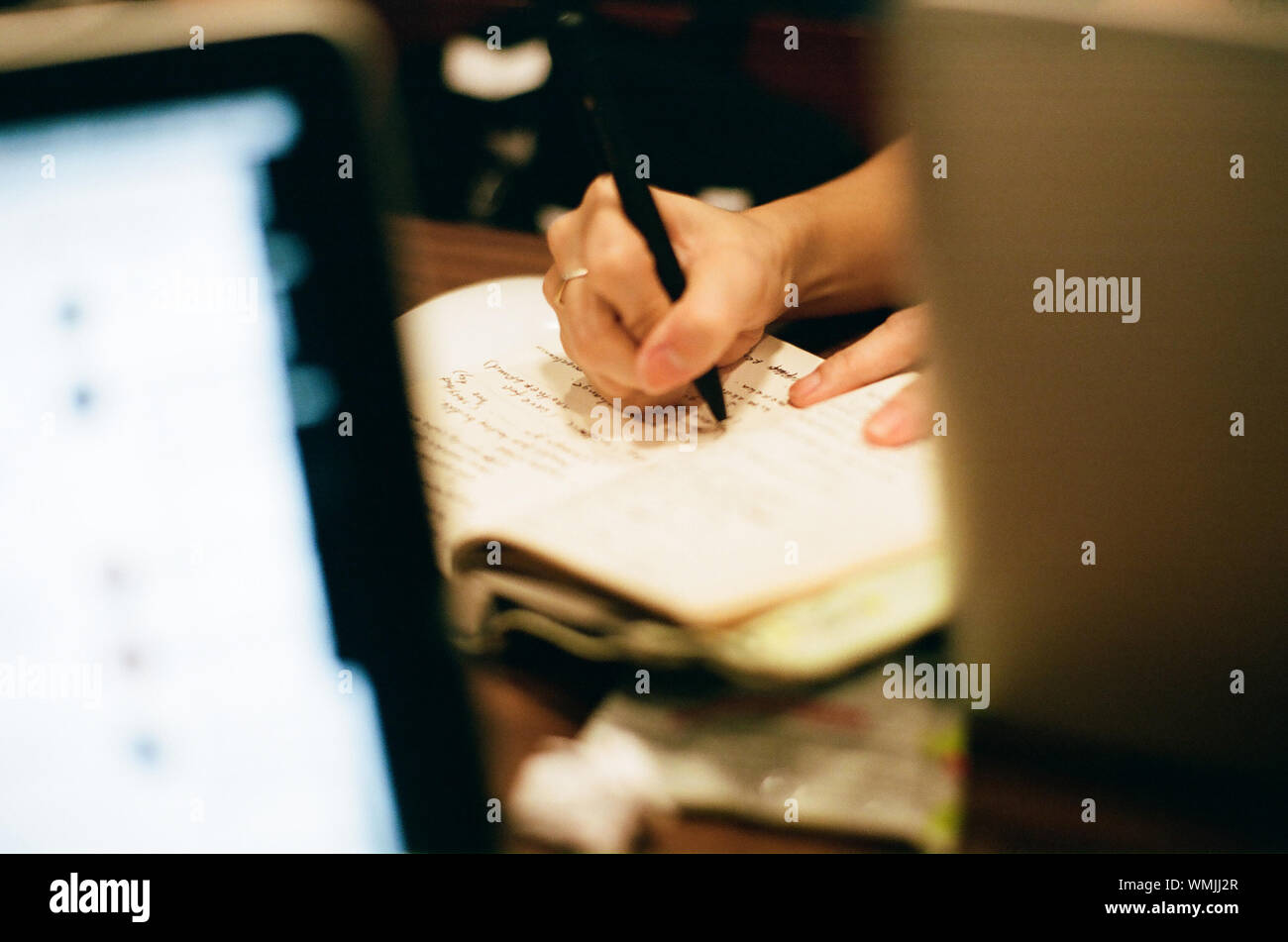 Adult taking notes hi-res stock photography and images - Alamy