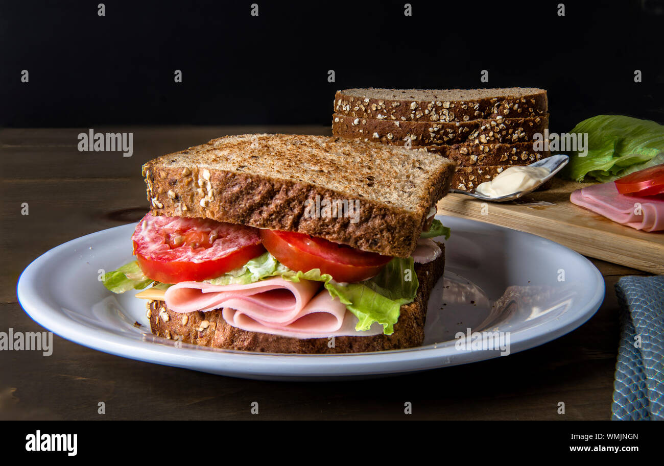 Macro, or close up of sandwich on a table, dark food or low key light ...