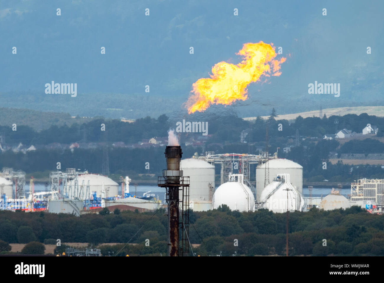 Gas flare stack burning at the Grangemouth oil refinery, Scotland Stock ...