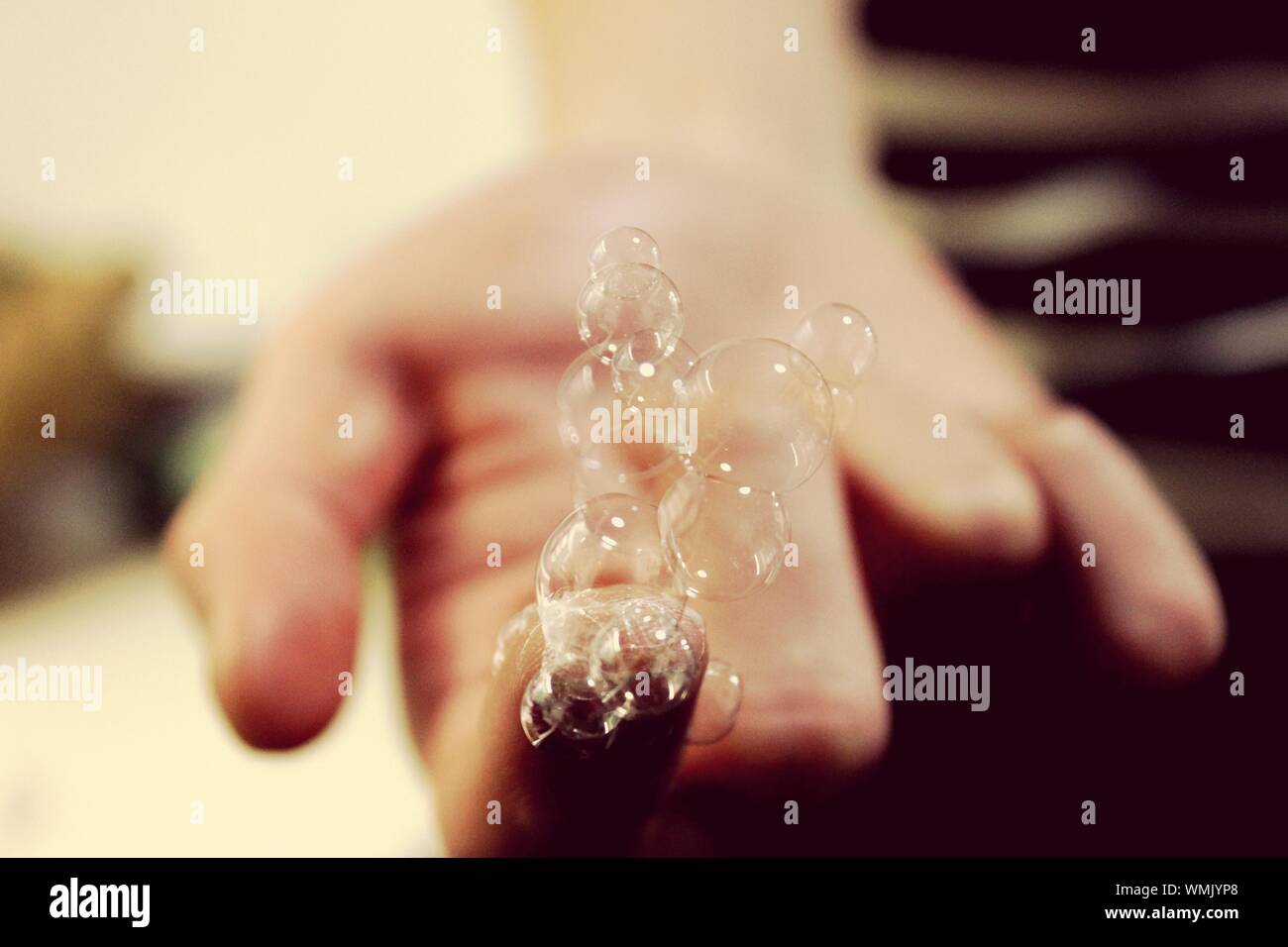 Hand and bubbles hi-res stock photography and images - Alamy