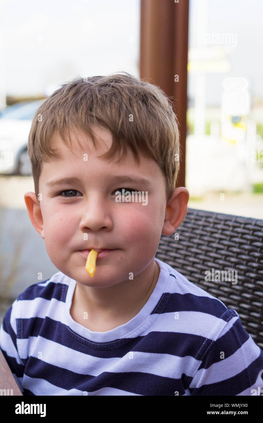 Cute boy is eating hi-res stock photography and images - Alamy