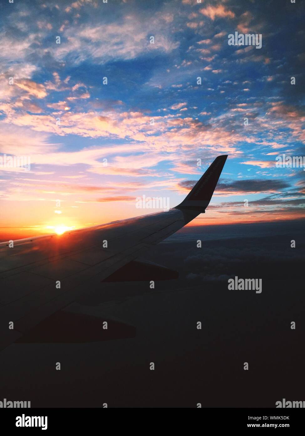 Airplane wing view sunset hi-res stock photography and images - Alamy