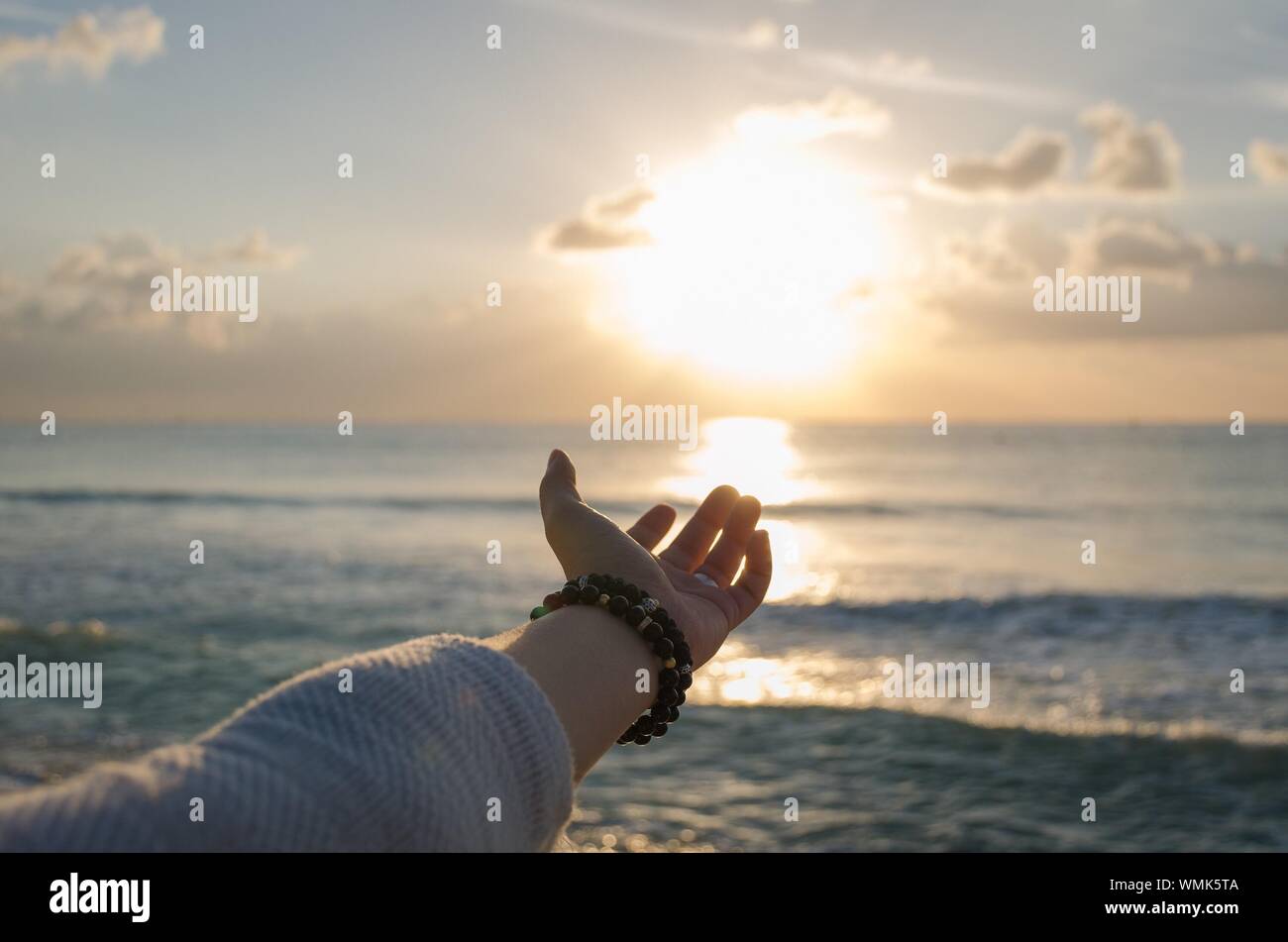Hand reaching towards sunlight hi-res stock photography and images - Alamy