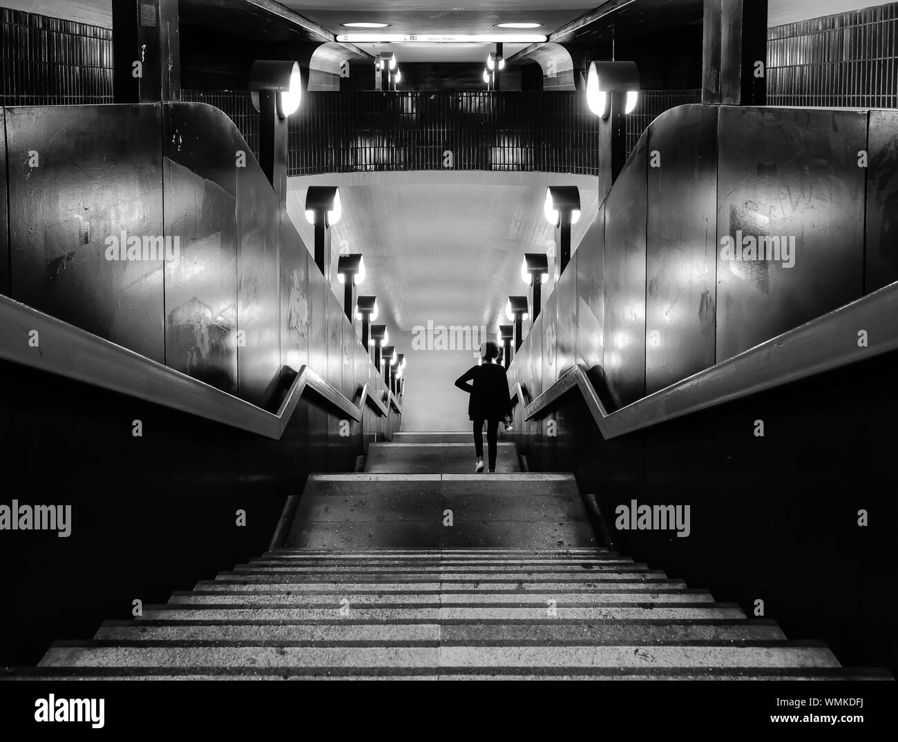 Stairs woman rear view Black and White Stock Photos & Images - Alamy