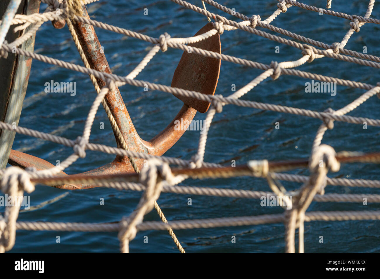 A detail of a sailing ship showing ropes and an anchor Stock Photo - Alamy