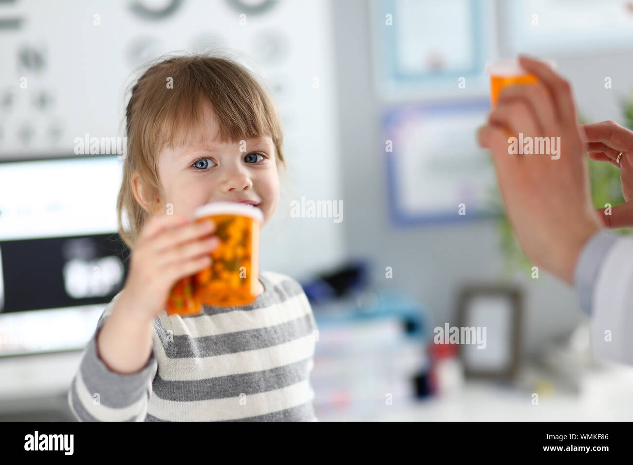 Cute baby with doctor in hospital Stock Photo - Alamy