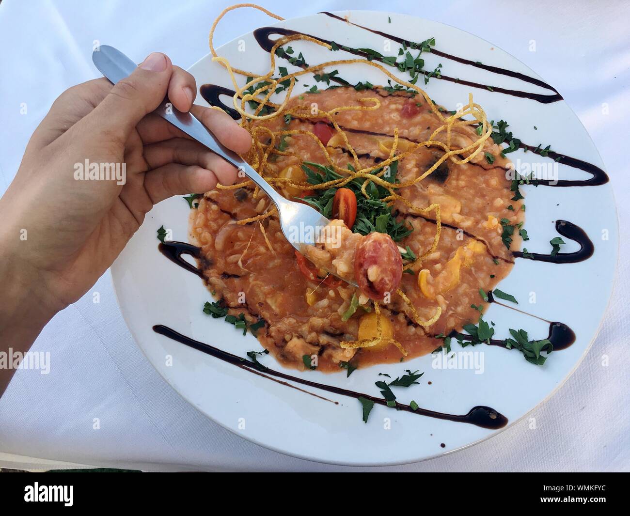 Hand and fork hi-res stock photography and images - Alamy