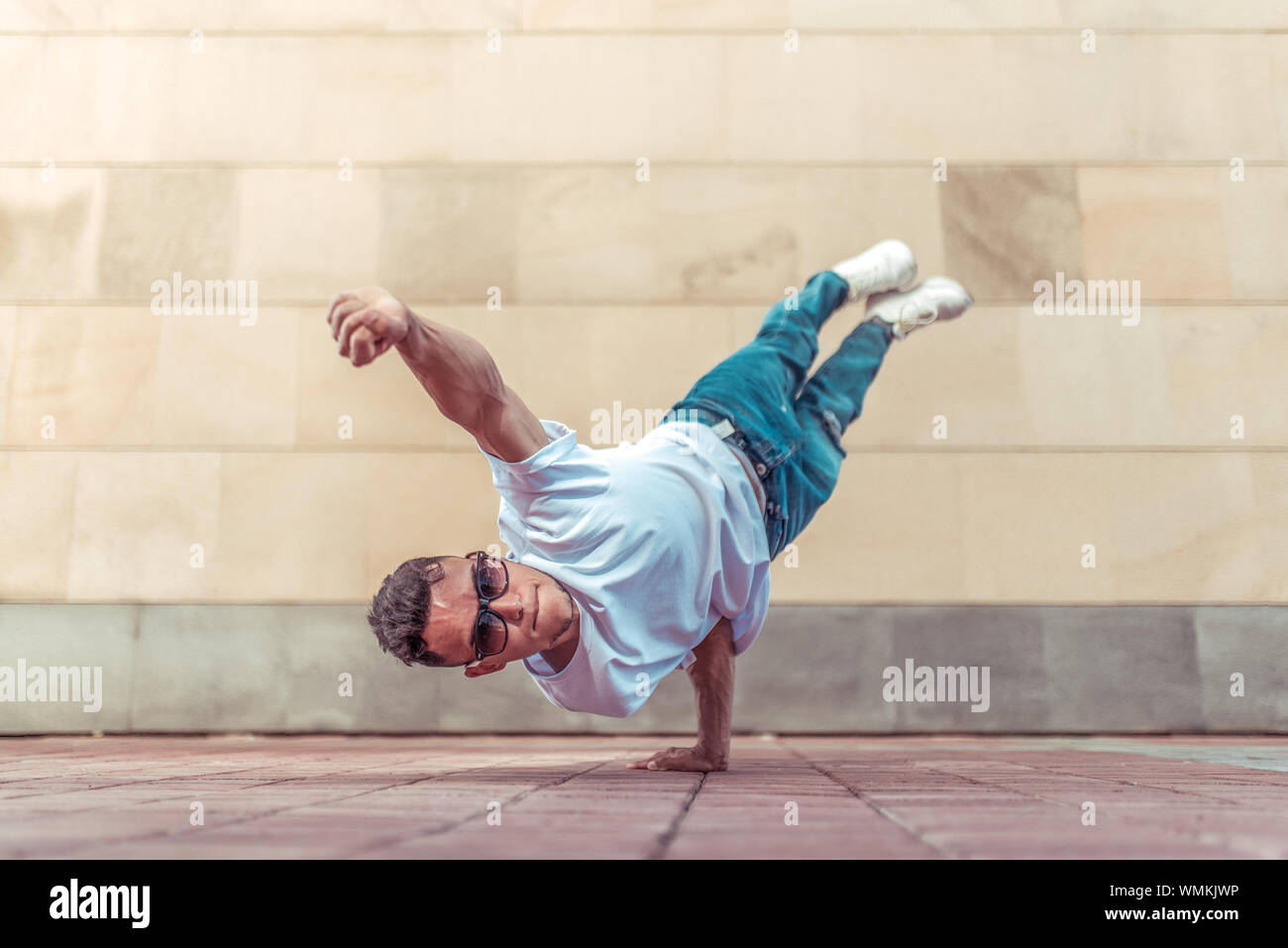 man dances on one arm, super man's pose, flies into distance like ...