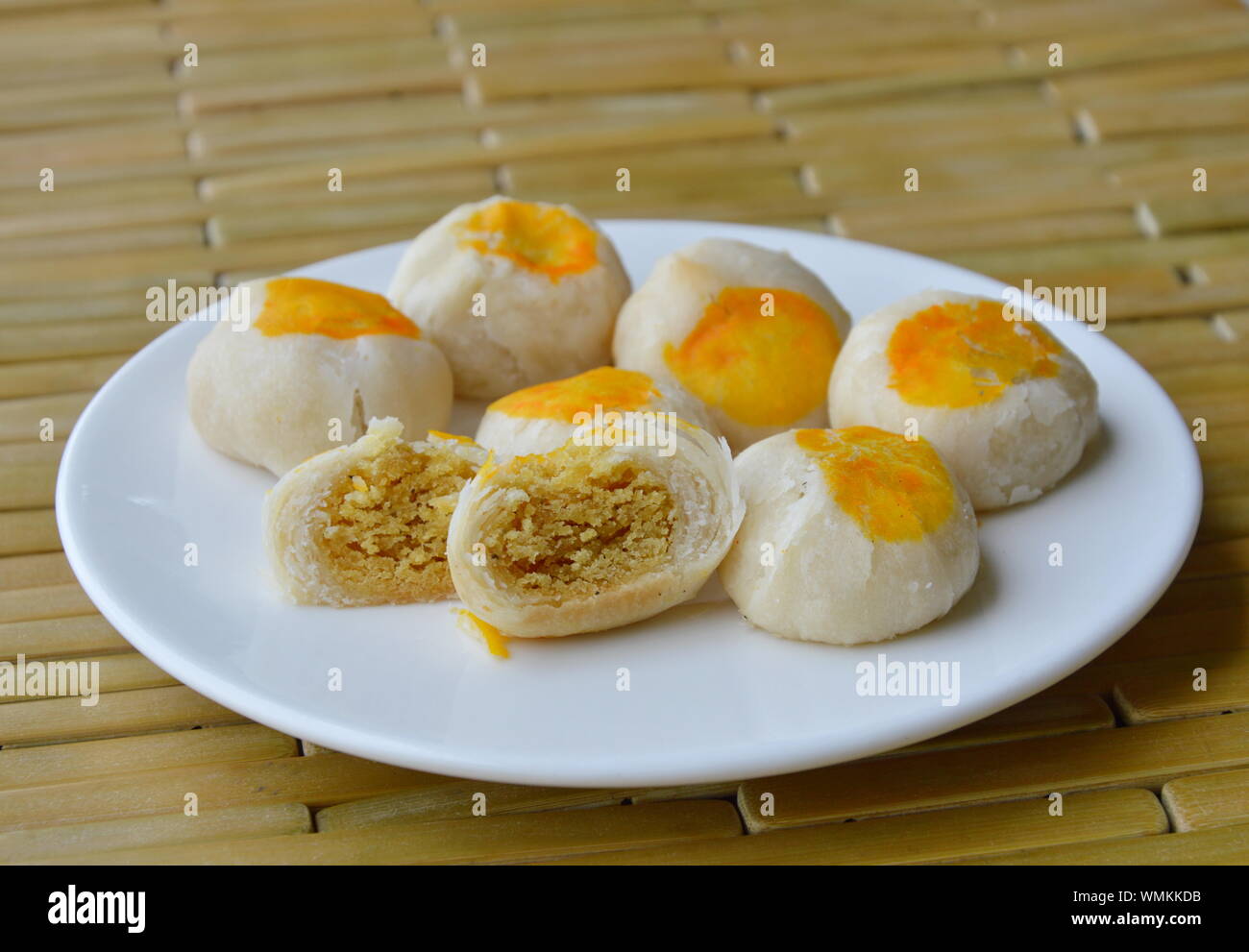 Chinese cake filling sweet bean and salty egg yolk on dish Stock Photo ...