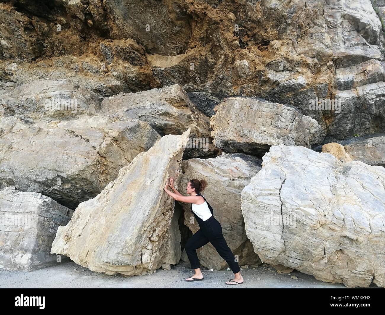 Pushing the rock hi-res stock photography and images - Alamy