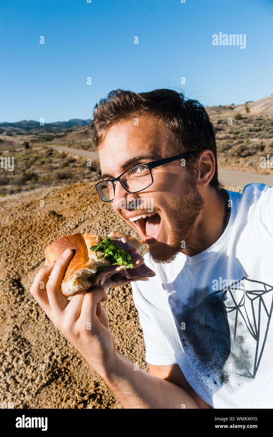 Man biting sandwich hi-res stock photography and images - Alamy