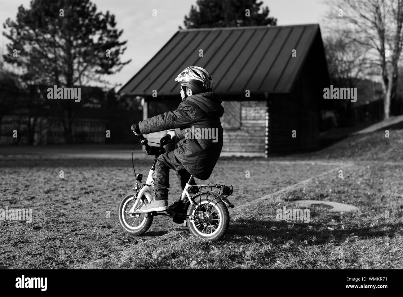 Boy Riding His Bicycle Black and White Stock Photos & Images - Alamy