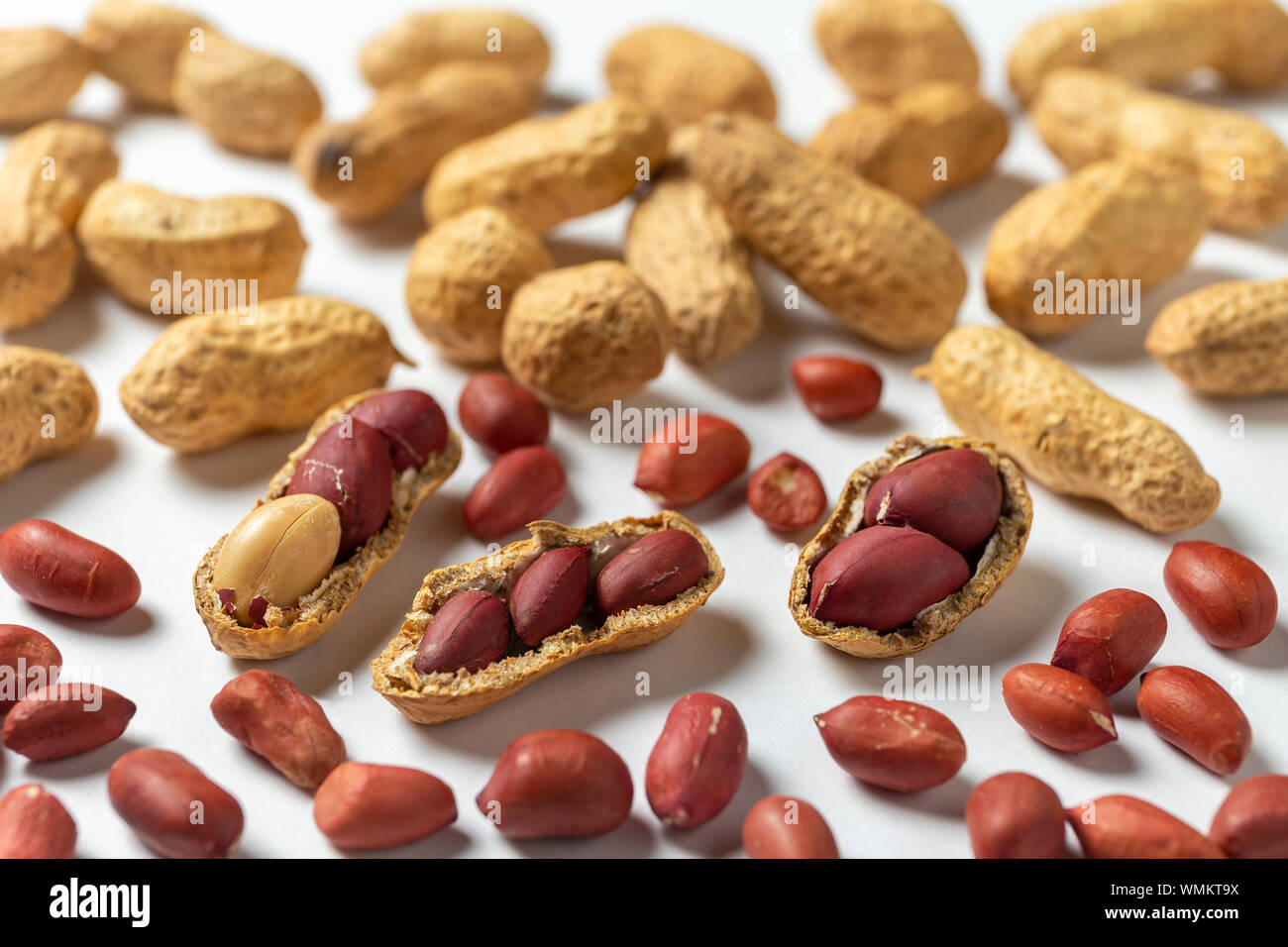 Group of peanuts on a white Stock Photo - Alamy