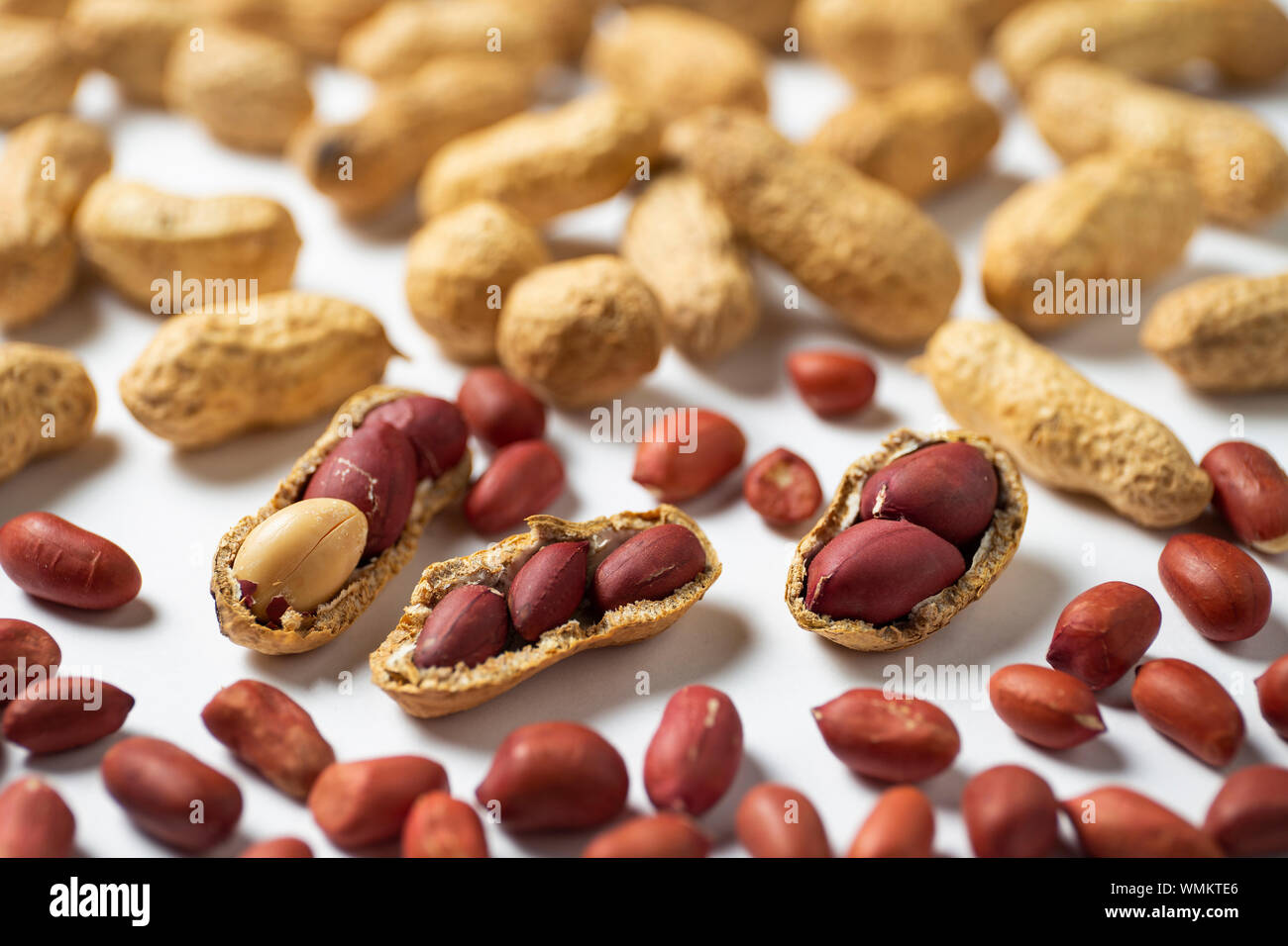 Group of peanuts on a white Stock Photo - Alamy
