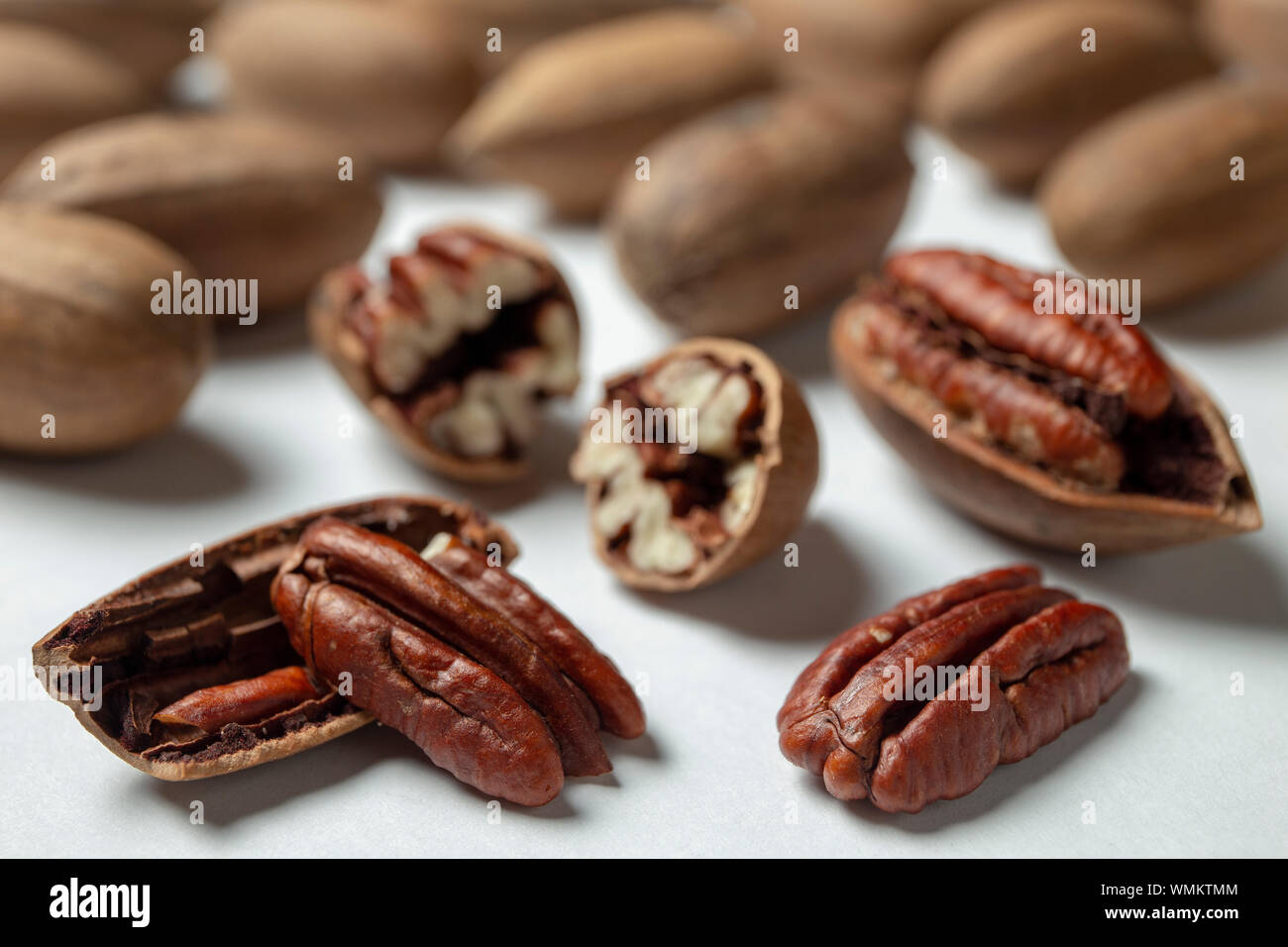 Group of pecan nuts on the white Stock Photo - Alamy