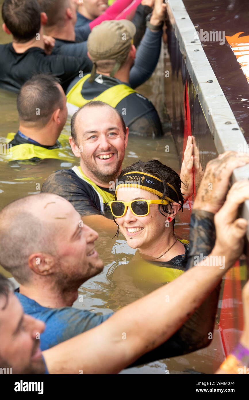 Contestants in the ‘Block Ness Monster’ obstacle at the Tough Mudder ...