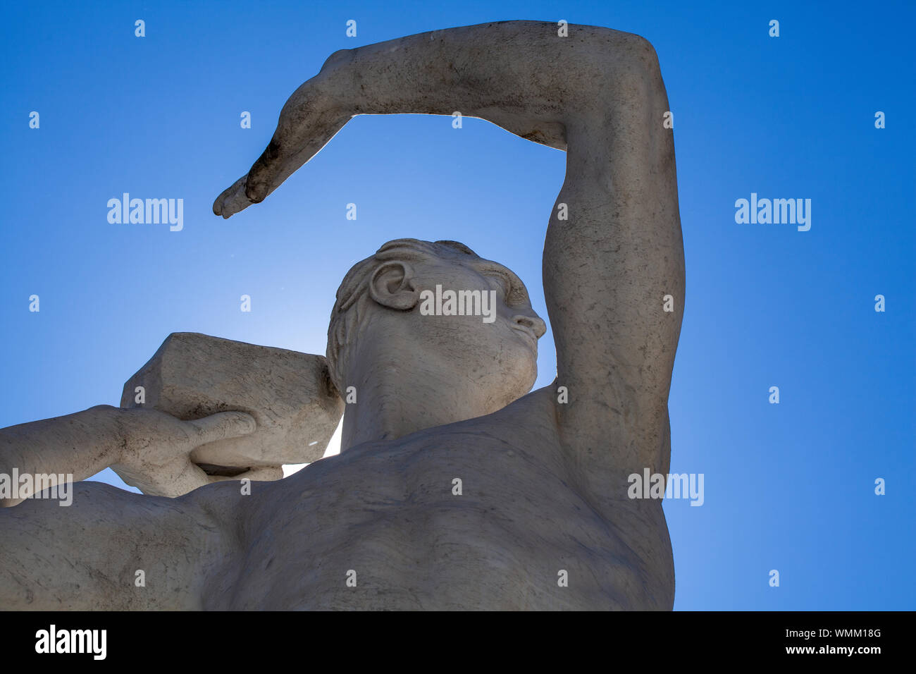 A stone statue of a boxer in the Stadio dei Marmi in Rome. The statue ...