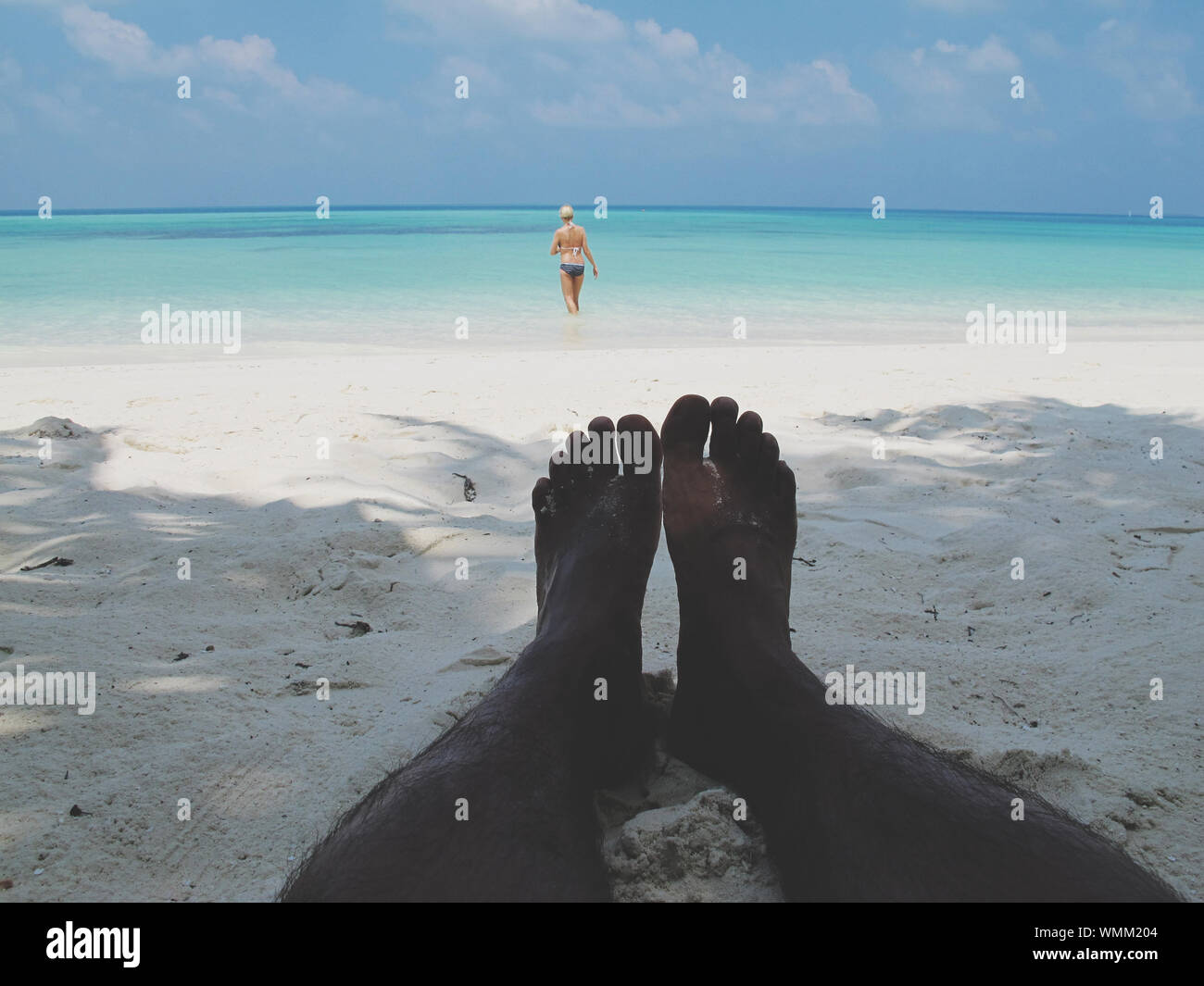 Mans feet at beach hi-res stock photography and images - Alamy