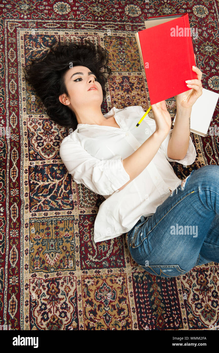 Woman lying floor hi-res stock photography and images - Alamy