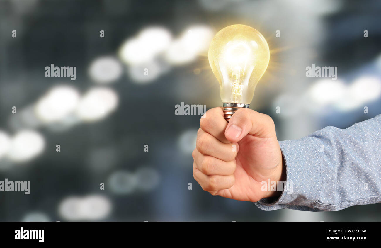 Hand of holding illuminated light bulb, idea, innovation inspiration concept Stock Photo - Alamy