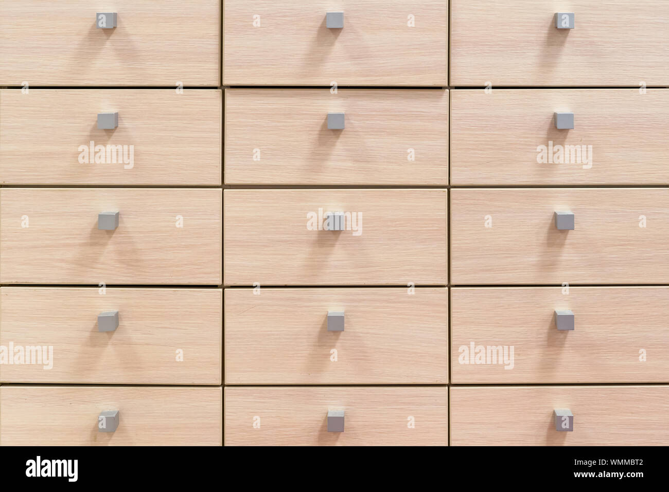 Wooden cabinet with many drawers close up. Office theme texture and ...