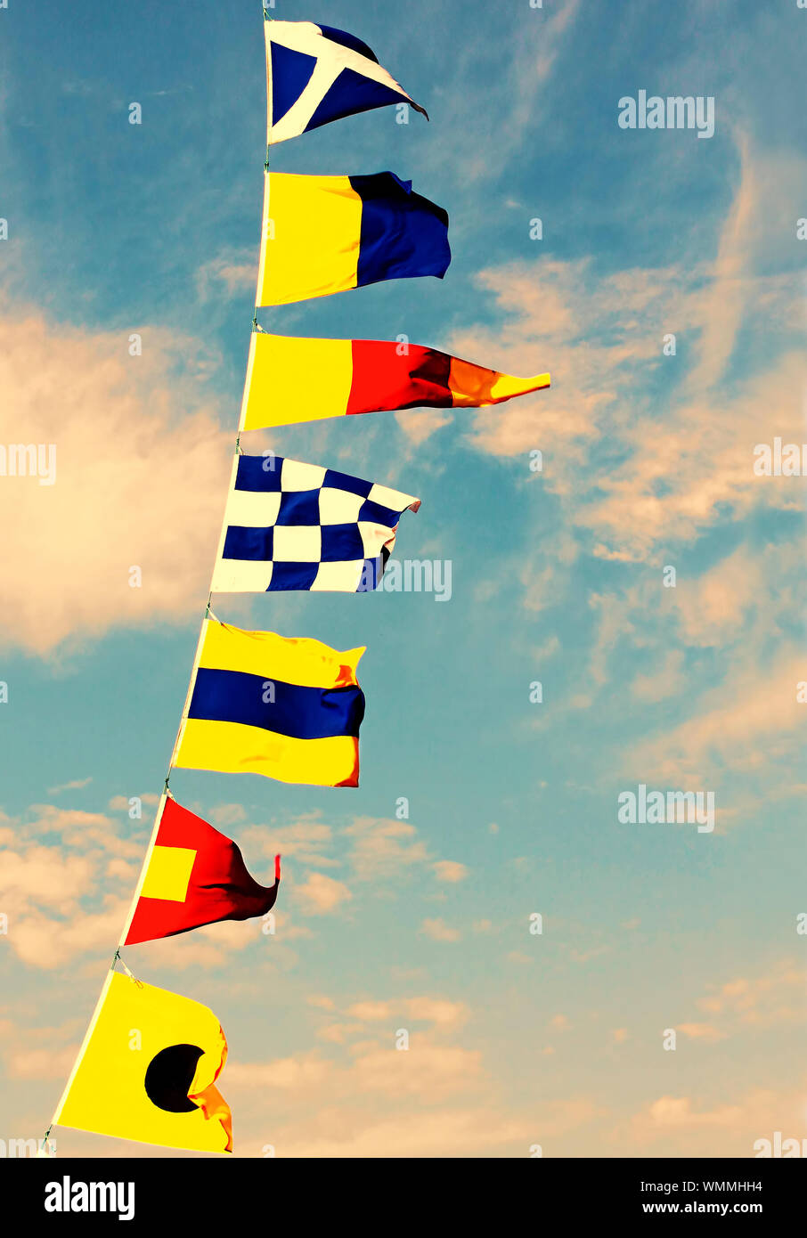 Marine signal flags on a dramatic sky backround. Toned image Stock ...