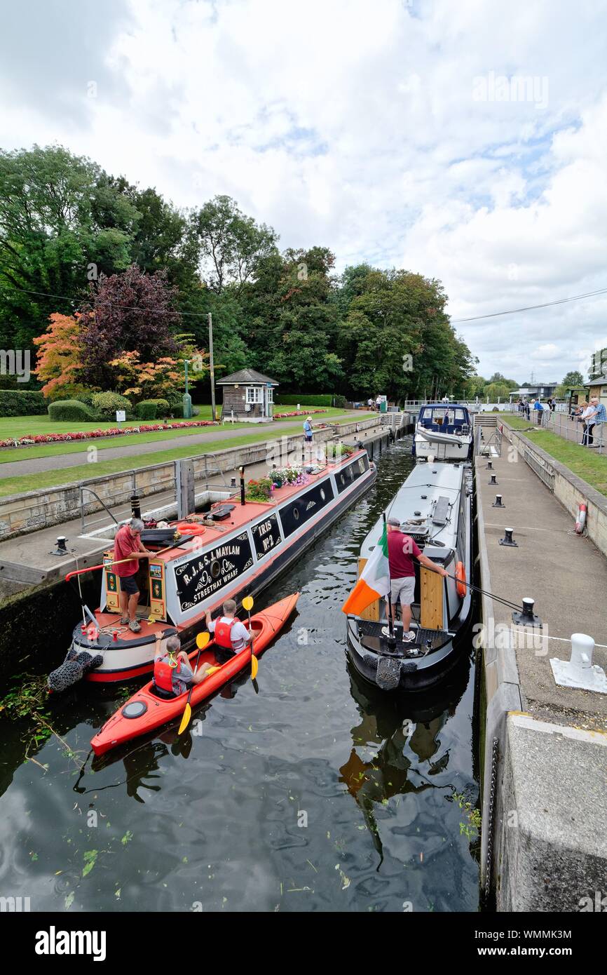 Various river crafts passing through Shepperton lock Surrey England UK ...
