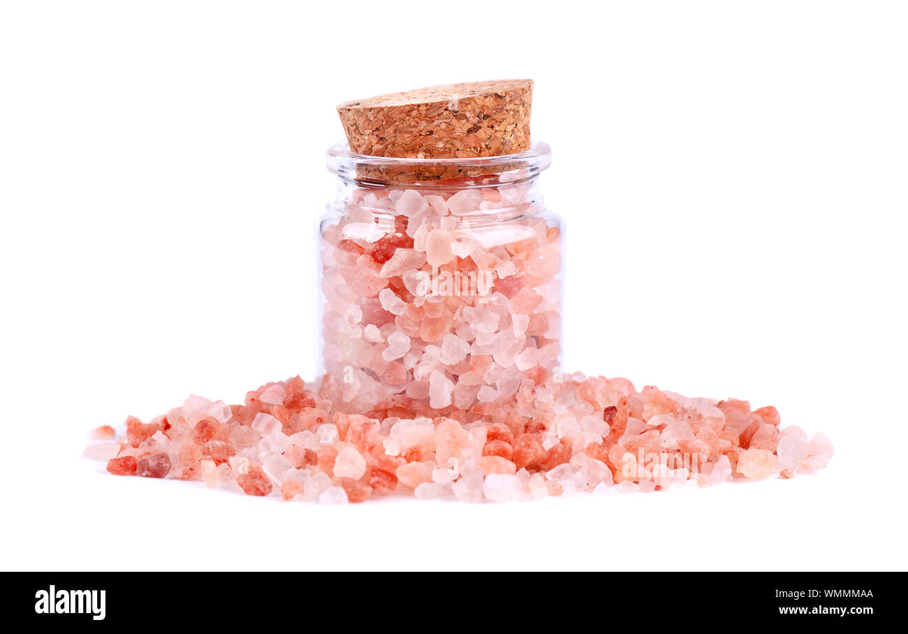 Himalayan pink salt in glass jar, isolated on white background ...