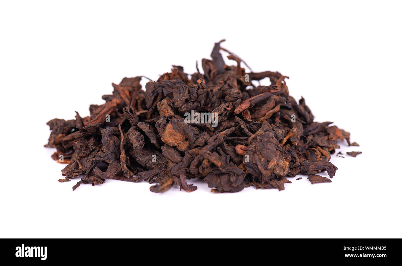 Chinese tea Shou Puer. Pressed fermented Pu-erh tea. Macro close up ...