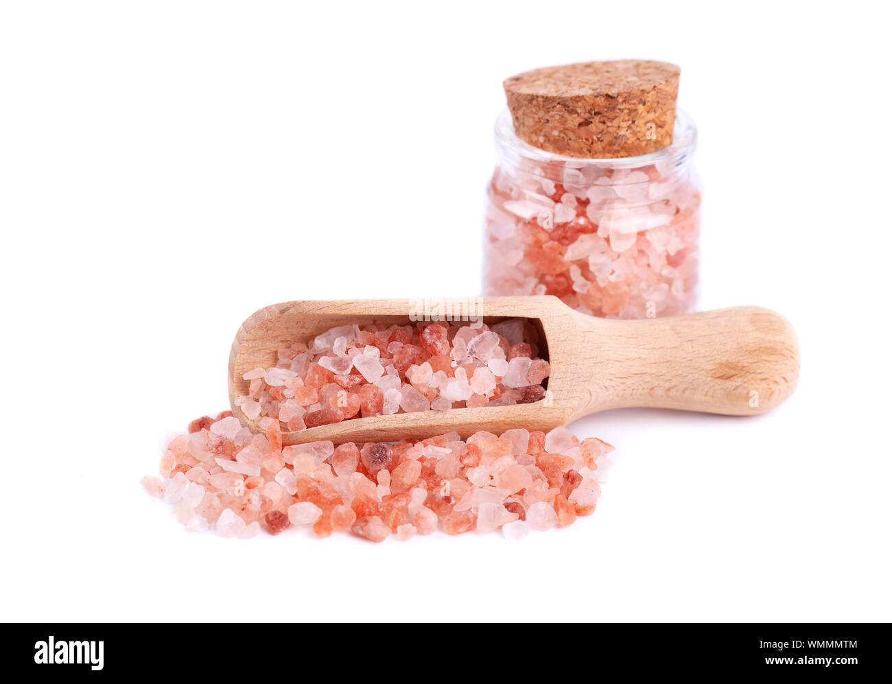 Himalayan pink salt in glass jar, with wooden spoon, isolated on white ...